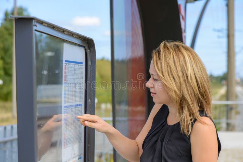 Woman Looking a Timetable in a Station Stock Image - Image of female ...