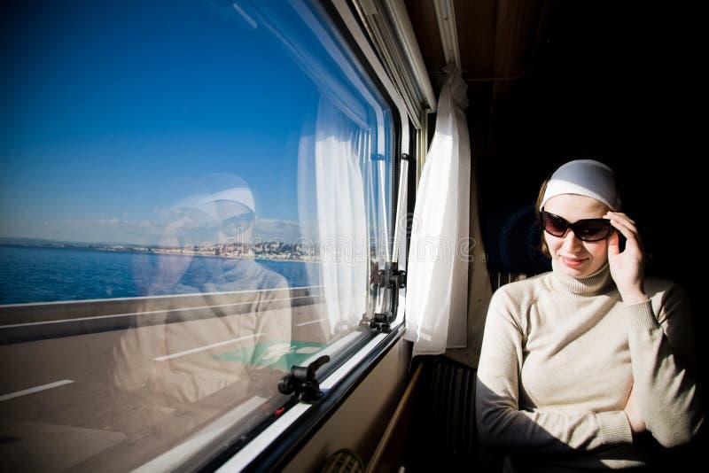 Woman Looking through Window Stock Photo - Image of beautiful, smiling ...