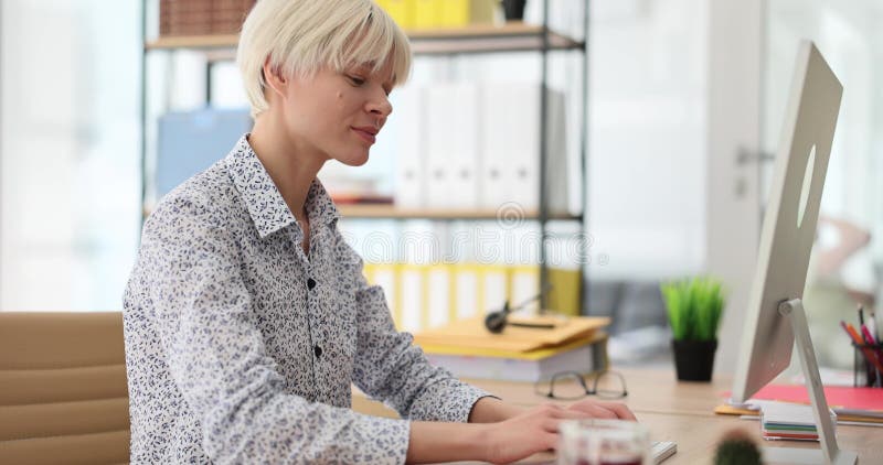 Woman Looks at Computer Screen Typing on Keyboard in Office Stock ...