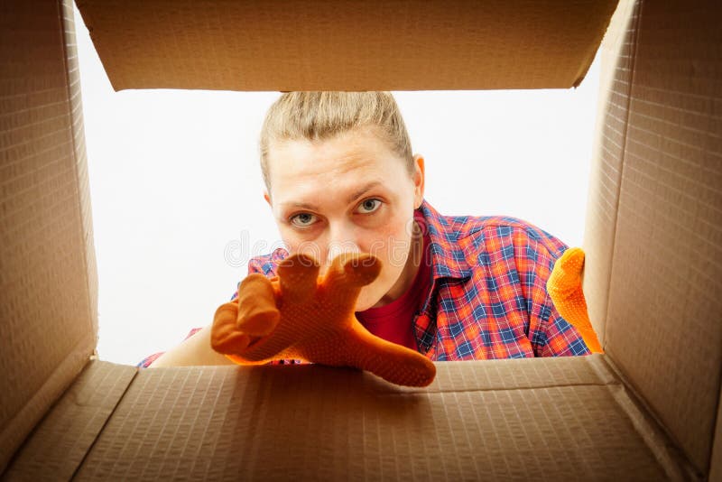 A Woman Looks into the Empty Box from the Inside.photo of a Woman ...