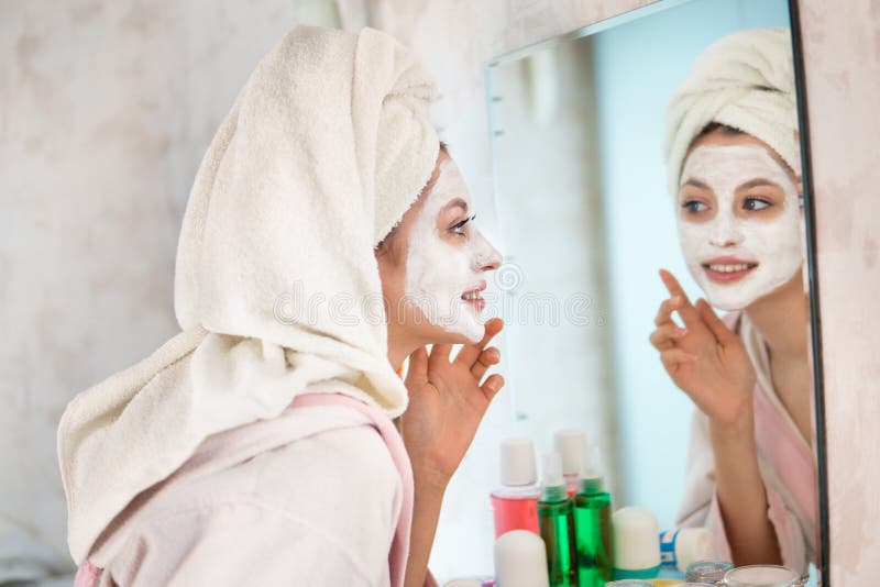 Woman Looks after the Face Makes a Mask Stock Photo - Image of fashion ...