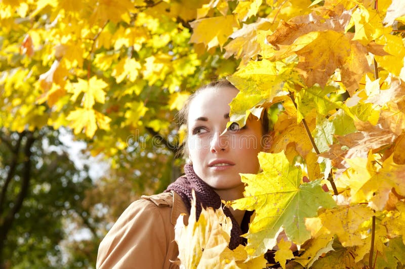 Woman looks through leaves stock photo. Image of green - 27930350