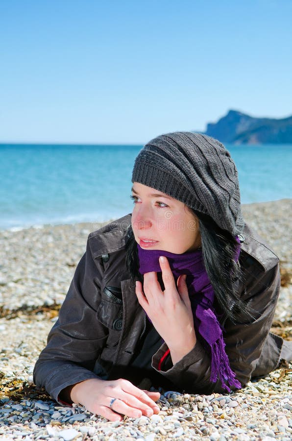Woman lying on the beach stock photo. Image of water - 35185130