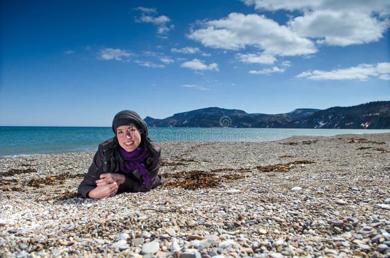Woman lying on the beach stock photo. Image of water - 35185130