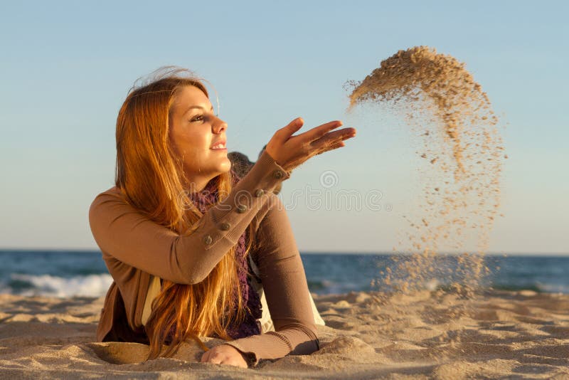 Woman with sand in hands stock image. Image of close - 20727719