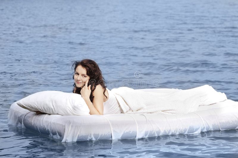 Woman Lying on the Bed in the Sea Stock Image - Image of lying, adult ...