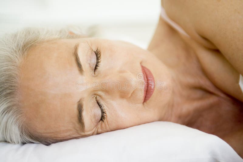 Woman Lying in Bed Sleeping Stock Image - Image of bedroom, beauty: 5930487