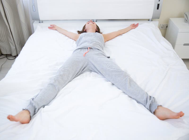 Woman Lying On The Bed In Star Pose Stock Image Image Of Smiling