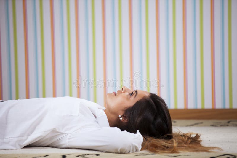 Woman lying in the carpet stock image. Image of casual - 48829347