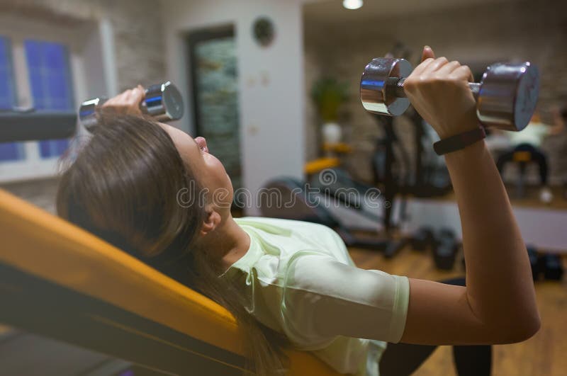Woman Doing Exercises with Dumbbells Stock Photo - Image of exercising ...