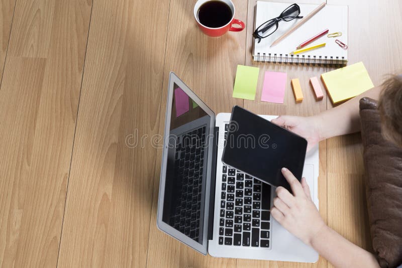 Woman Lying on Floor with Computer Notebook and Tablet Stock Image ...
