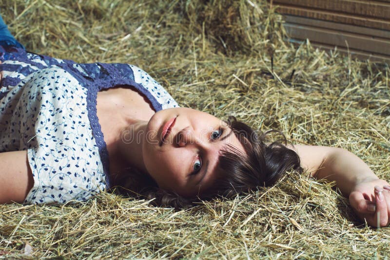 Woman lying on hay stock image. Image of pretty, barefoot - 26952753