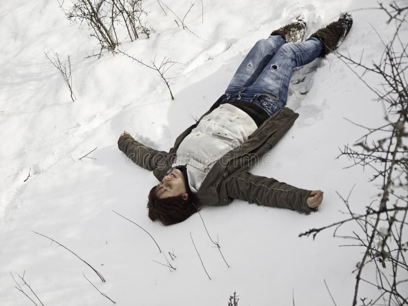 Woman lying in snow stock image. Image of female, lifestyle - 80257791