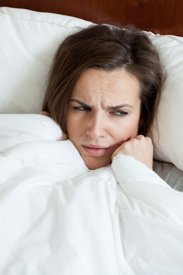 Woman lying under duvet stock photo. Image of catarrh - 48608432