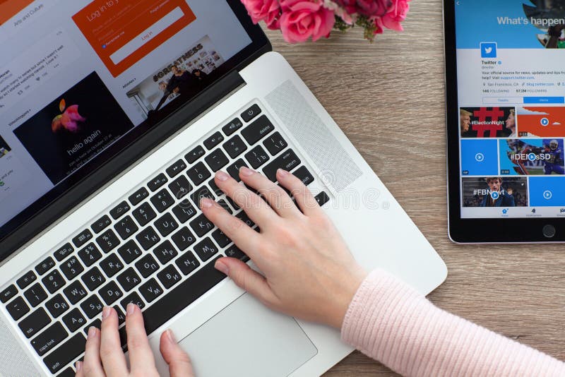 Woman with MacBook and IPhone with Social Networking Service Twitter ...