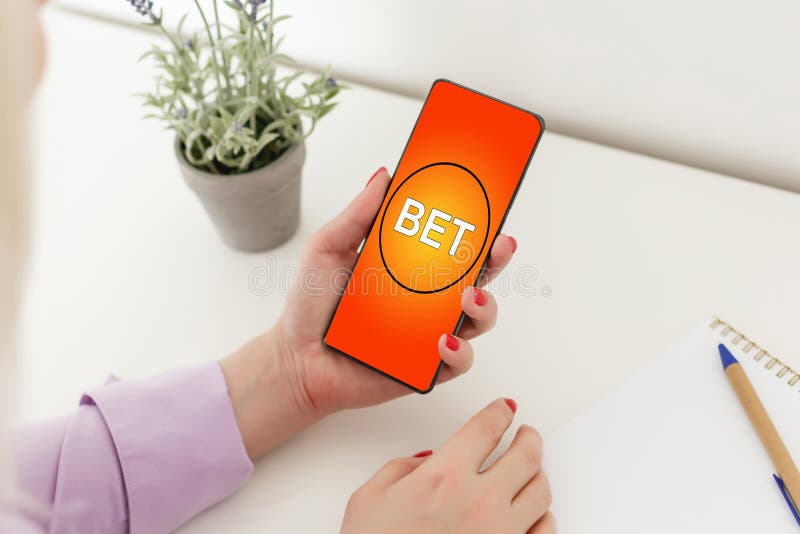 A Woman Makes Bets on a Tablet Stock Photo - Image of house, jackpot ...