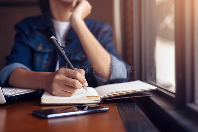 Woman Makes a Note in Notebook Stock Image - Image of manager, light ...