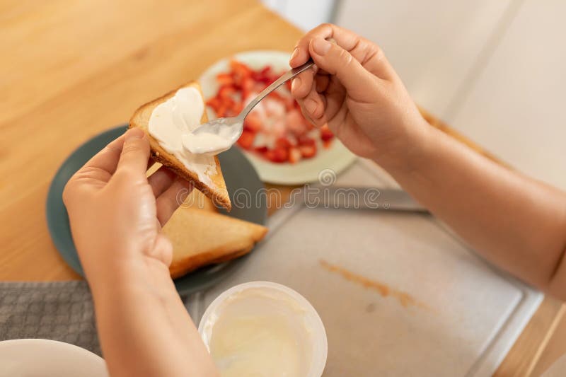 A Woman Makes a Sandwich for a Snack in the Kitchen Stock Image - Image ...