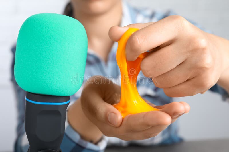 Woman Making ASMR Sounds with Microphone and Bright Slime, Closeup ...