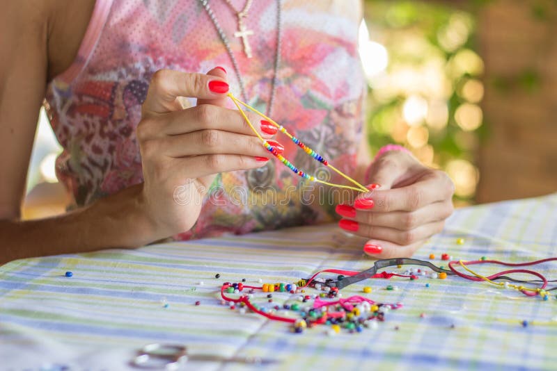 Woman making bracelet stock photo. Image of closeup, hands - 43558382