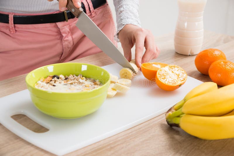 Woman Making Breakfast stock photo. Image of female, chopping - 57410702