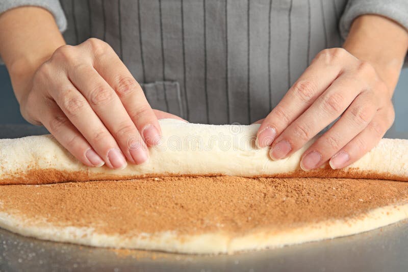 Woman Making Cinnamon Rolls at Table Stock Photo - Image of flavor ...