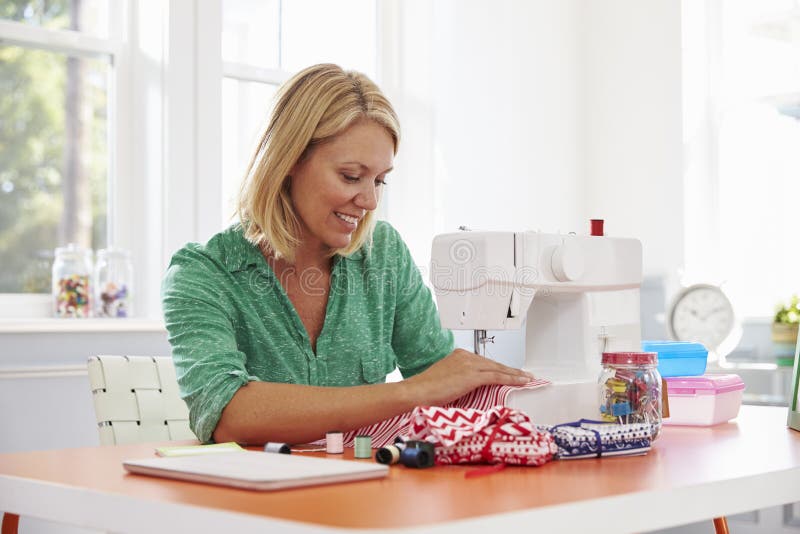 Woman Making Clothes Using Sewing Machine at Home Stock Image - Image ...