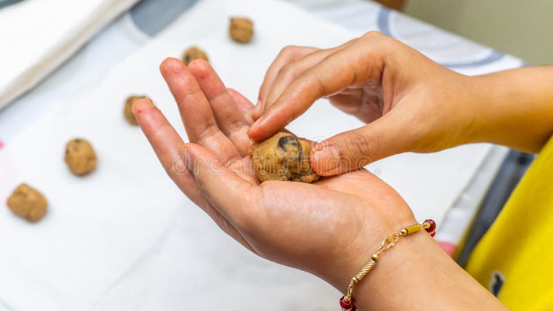 Woman Making a Cookies with Chocolate Chip Using Hands at the Kitchen ...