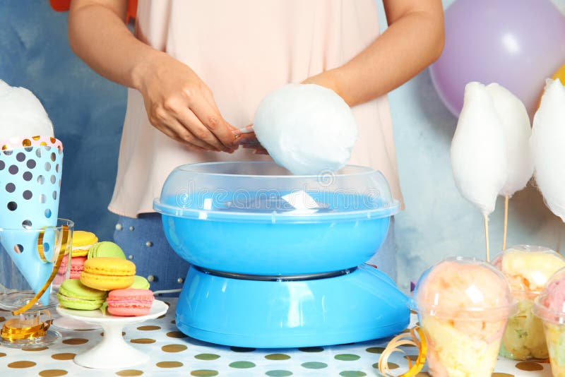 Woman Making Cotton Candy Using Modern Machine at Table Stock Image ...