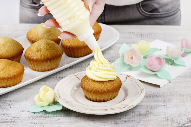 Woman making cupcakes stock photo. Image of buttercream - 42249094