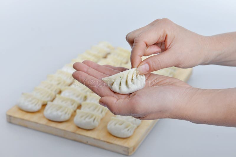 A woman making dumplings stock image. Image of asian - 36836541