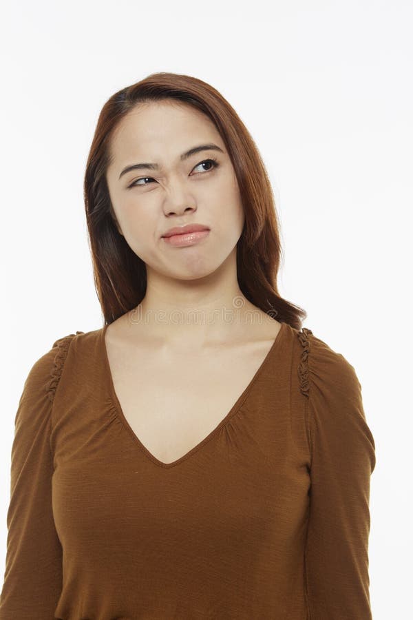 Woman making a face stock photo. Image of casual, unsure - 185430414