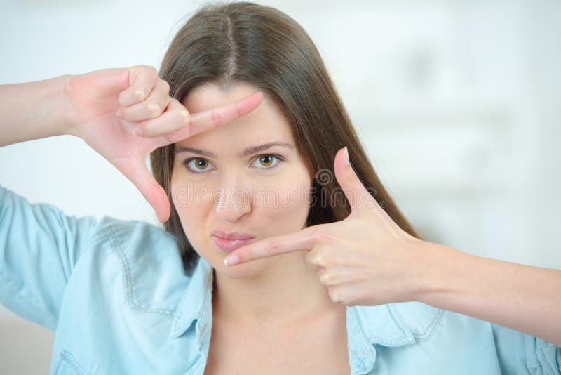 Woman Making Frame Around Face with Fingers Stock Photo - Image of ...