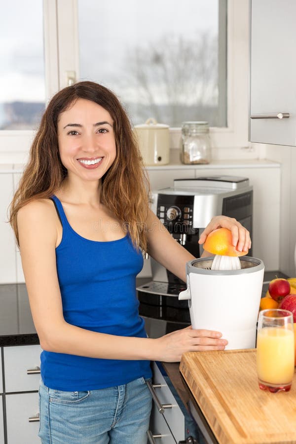 Woman making fruit juice stock photo. Image of nutrition - 65832372