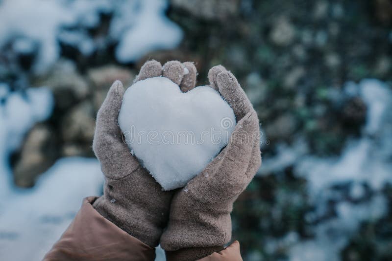 Woman Making Heart Symbol with Snowy Hands Stock Photo - Image of ...