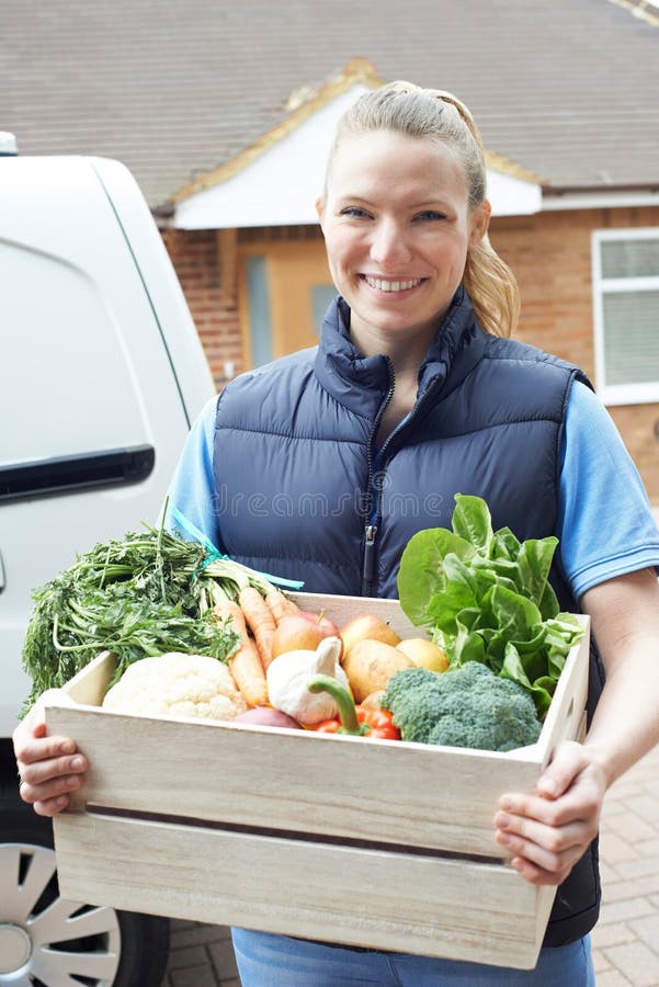 Woman Making Home Delivery of Organic Vegetable Box Stock Image - Image ...