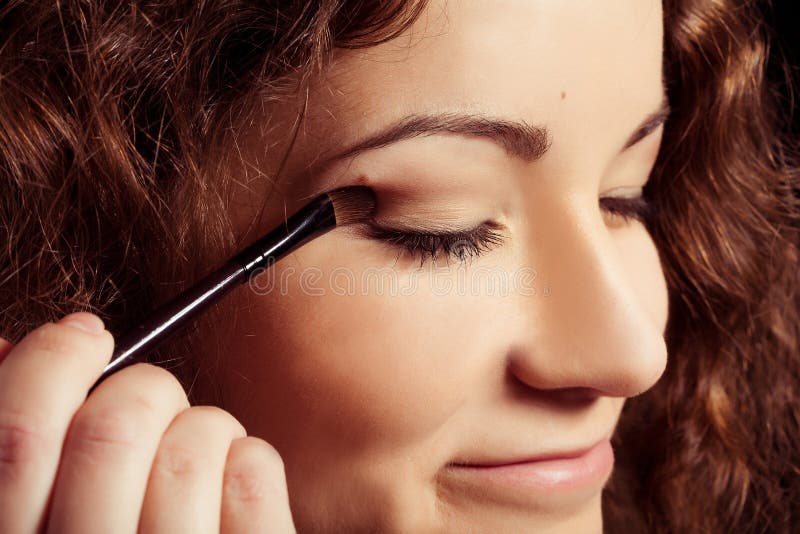 Woman is making make-up stock image. Image of hairstyle - 32600271