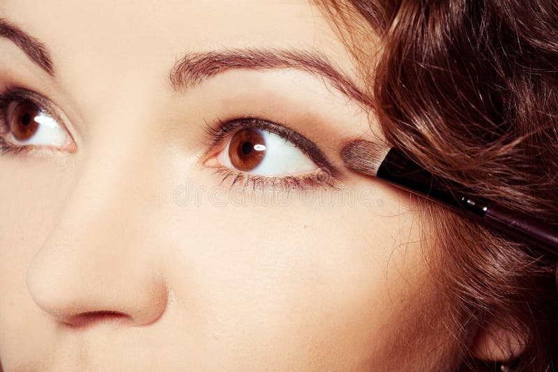 Woman is making make-up stock image. Image of holding - 32600305