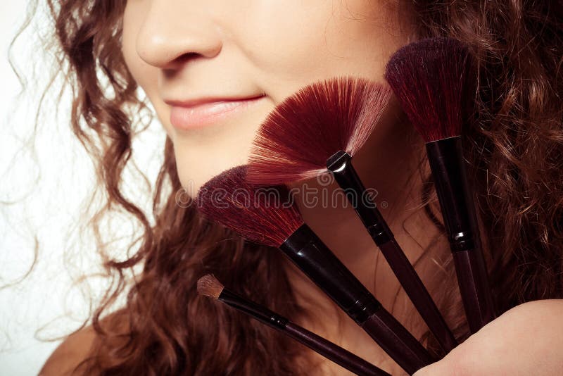 Woman is making make-up stock image. Image of hold, holding - 32600309