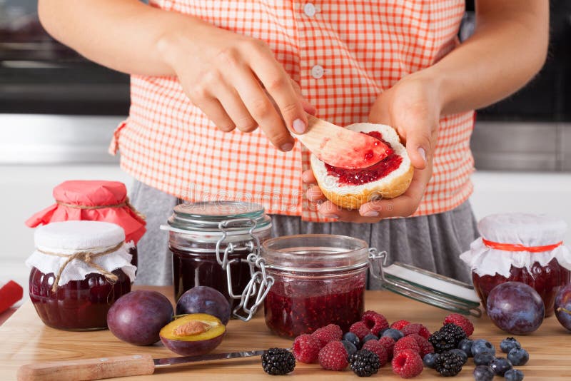 Woman Making a Sandwich with Jam Stock Image - Image of fruit, plums ...