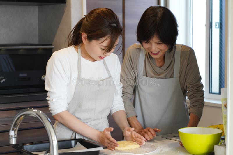 A woman making sweets stock photo. Image of family, house - 325197326