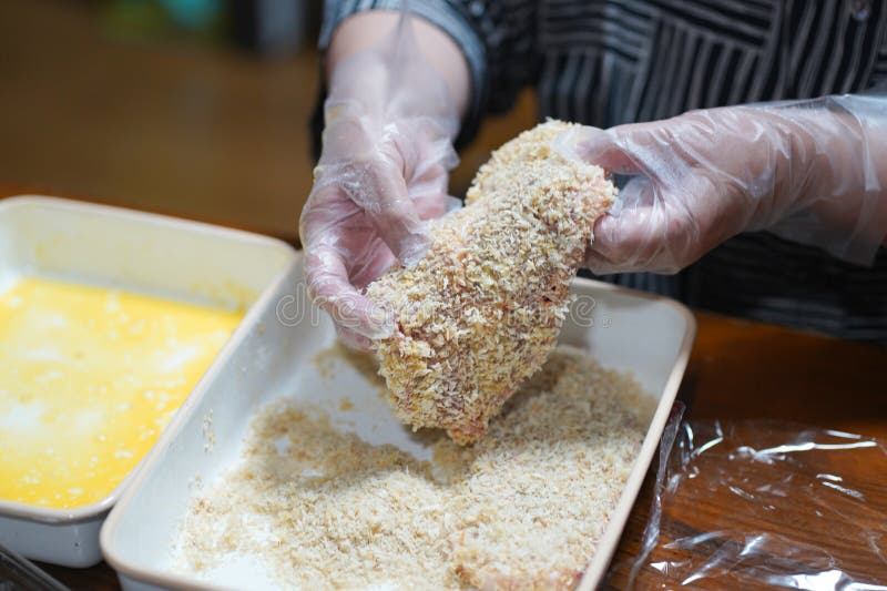 A woman making tonkatsu stock image. Image of eggs, woman - 328828327