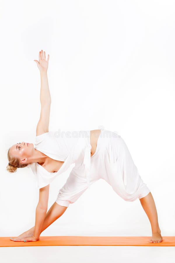 Woman making yoga figure stock photo. Image of beautiful - 64277940
