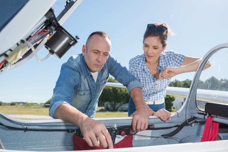 Woman and Man Checking Aircraft before Flight Stock Image - Image of ...