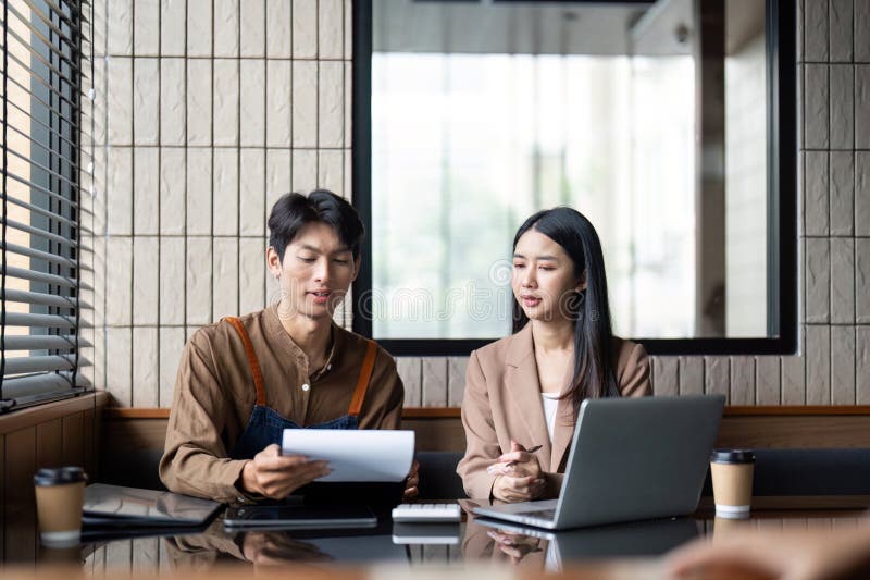 Effective Teamwork. Young Professionals Collaborating on a Project in a Modern Office ...