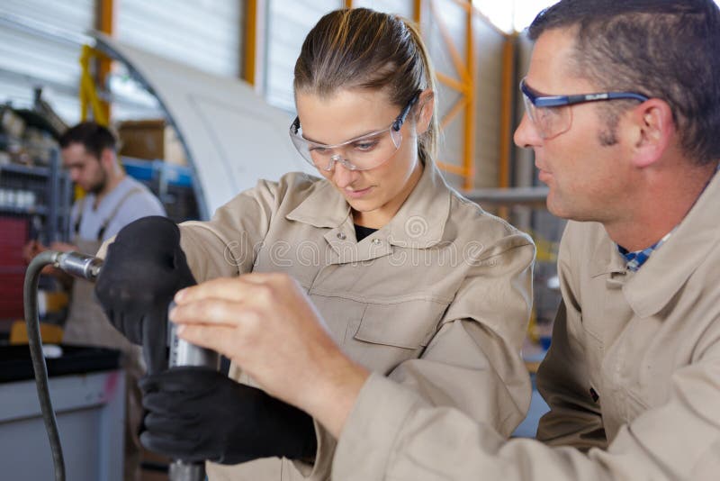 Woman and Man with Drill in Workshop Stock Image - Image of drill ...
