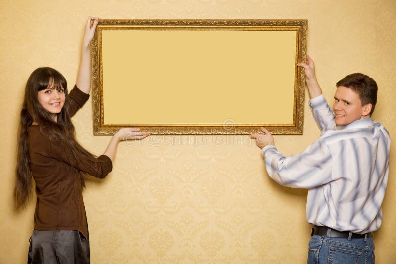 Woman and Man Hang Up on Wall Picture Stock Photo - Image of decorating ...