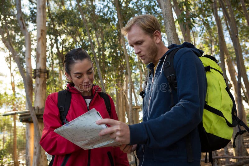 Woman and Man Hiker with Backpack Reading Map Stock Image - Image of ...