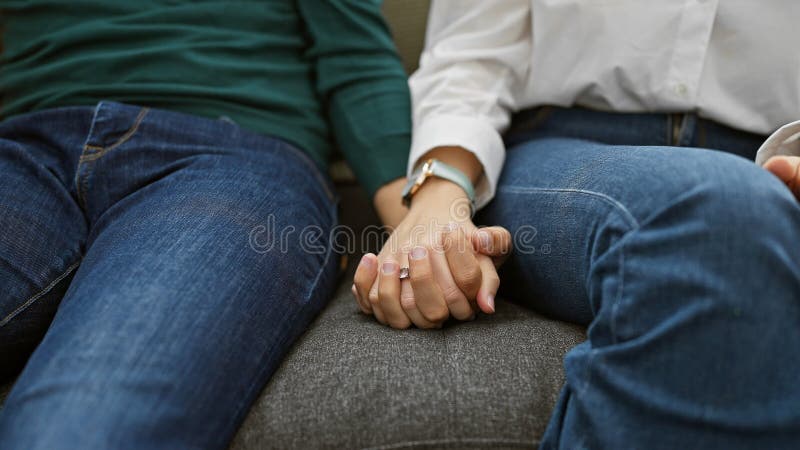 A Woman and a Man Holding Hands, Showcasing Intimacy and Connection in ...
