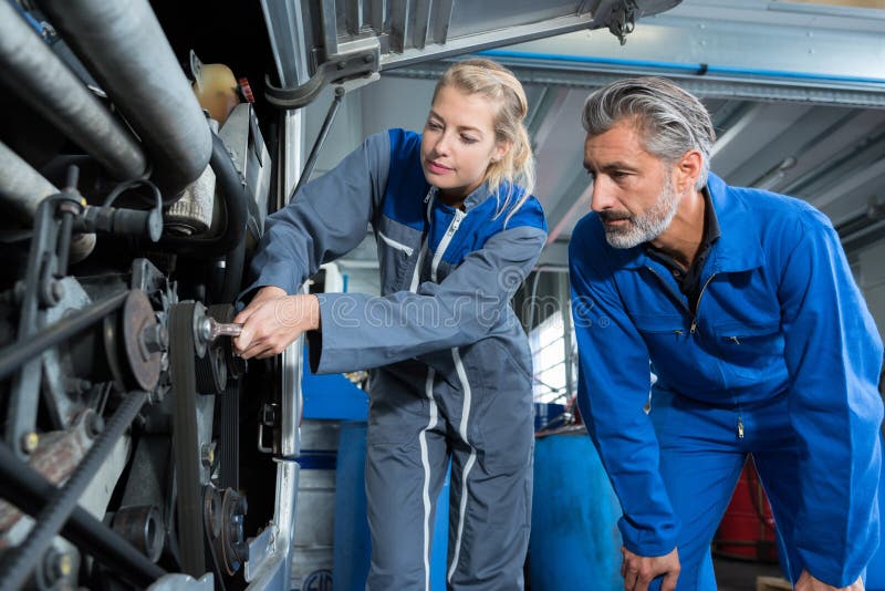 Woman and Man Mechanic Working on Bus Stock Image - Image of ...